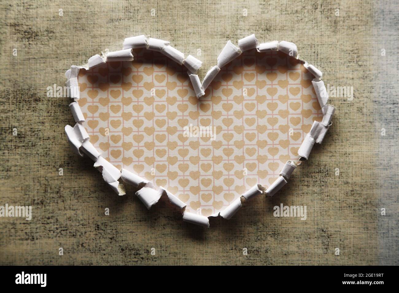 Torn paper heart over colorful background Stock Photo - Alamy