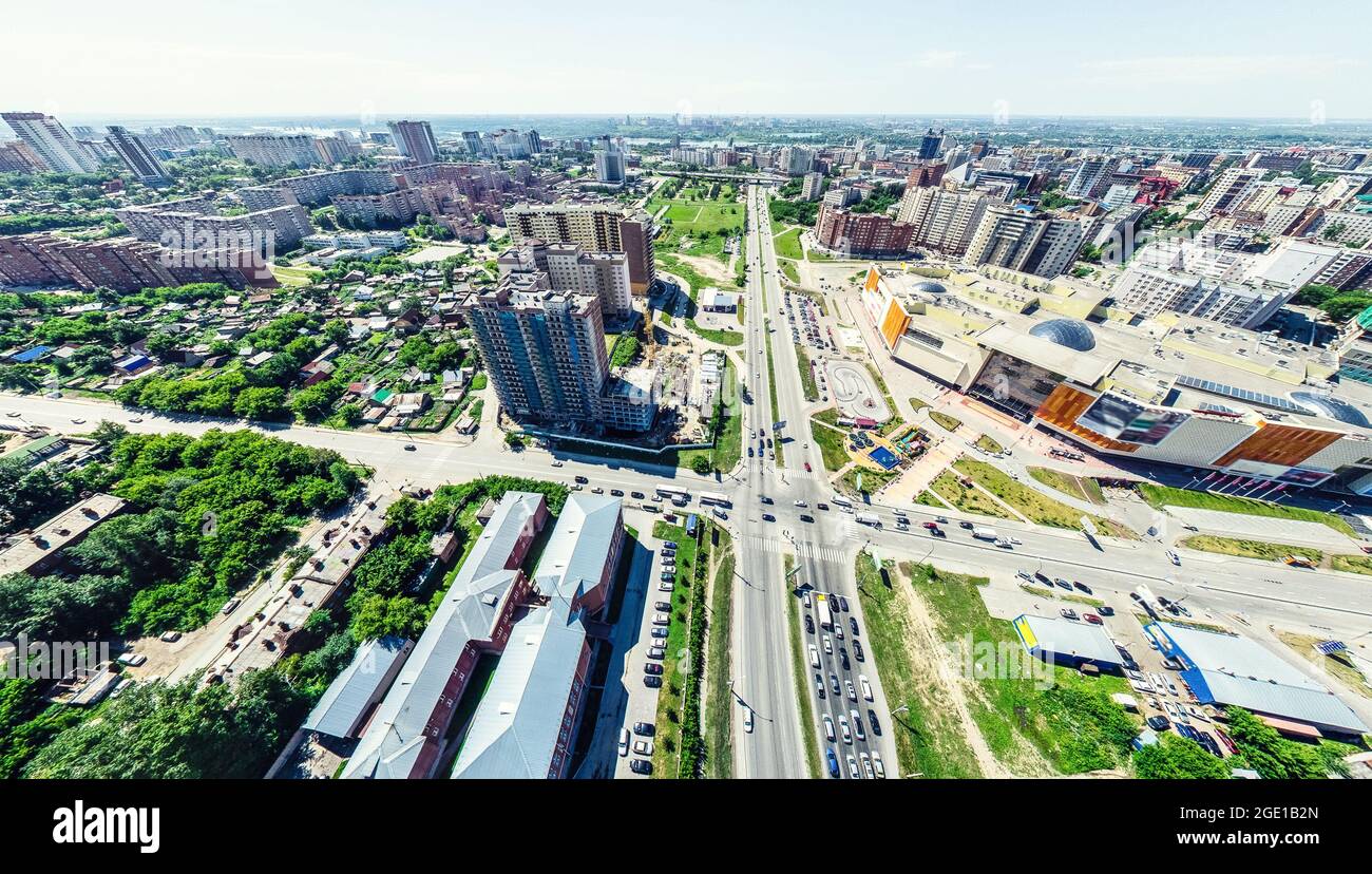 Aerial city view with crossroads and roads, houses, buildings, parks ...