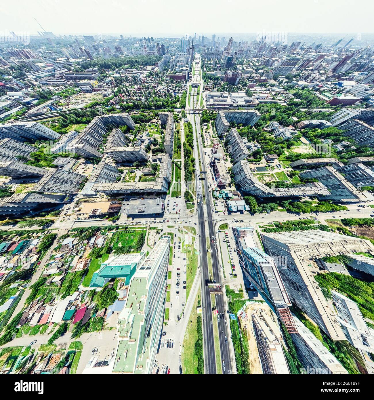 Aerial city view with crossroads and roads, houses, buildings, parks ...