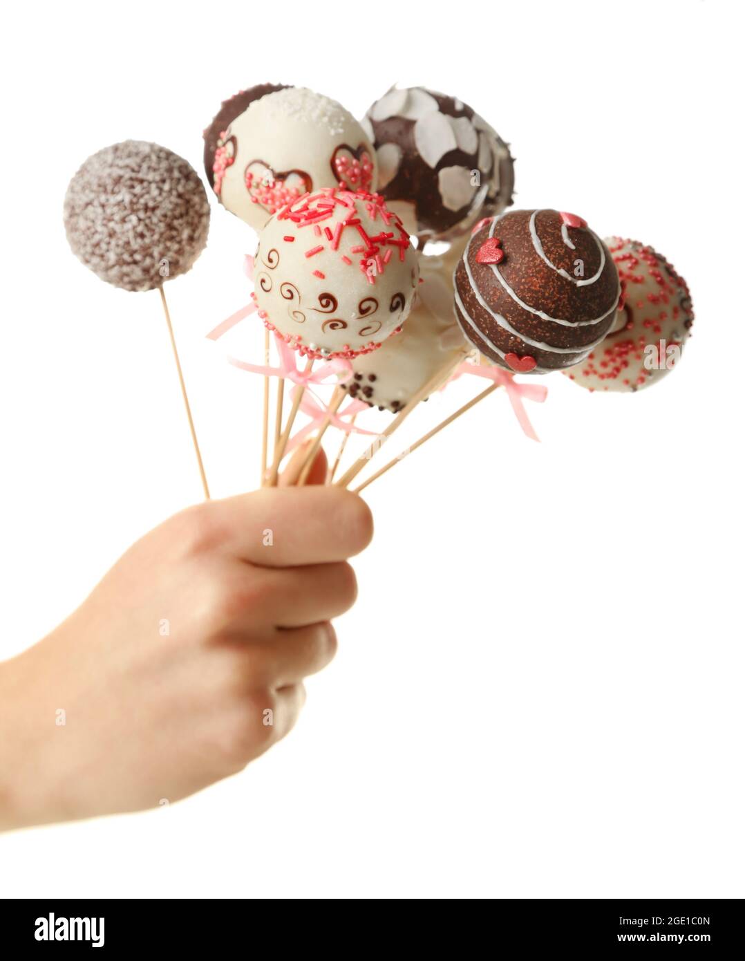 Female hand holding cake pops, isolated on white Stock Photo - Alamy