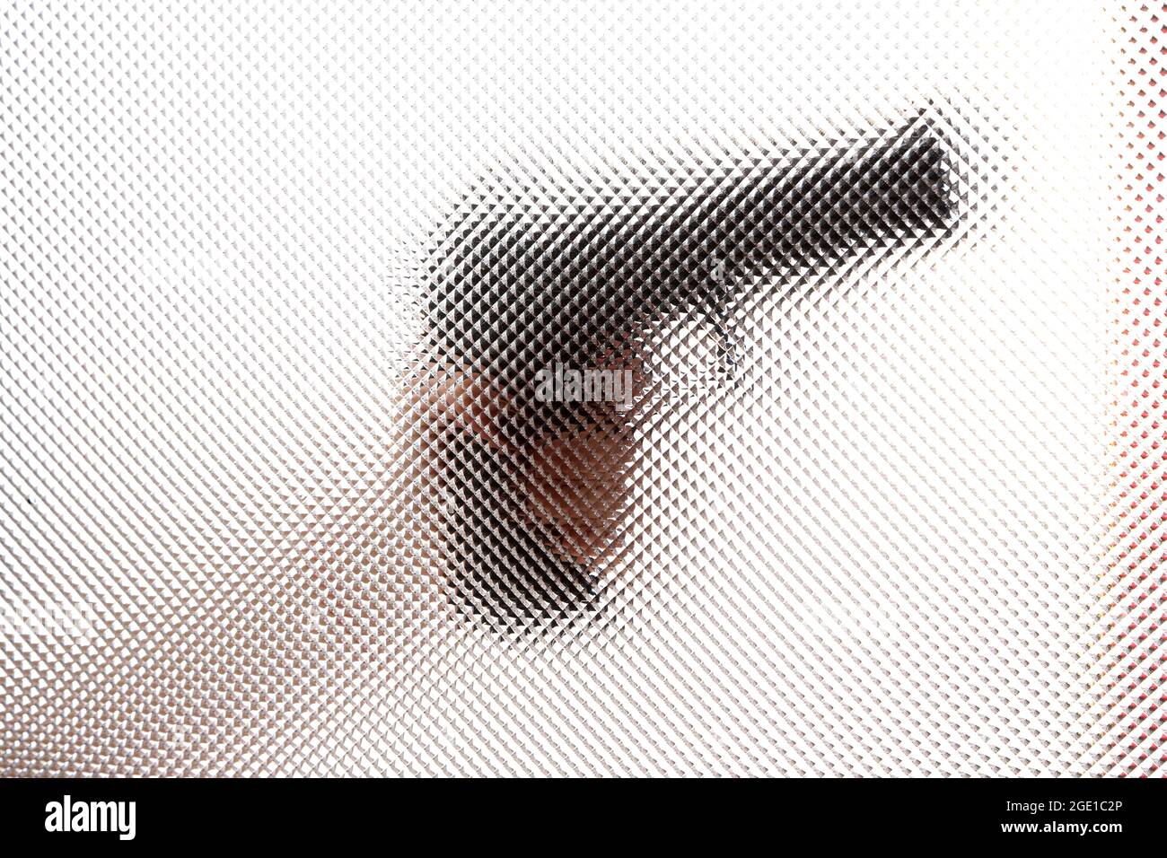 Hand holding gun on white background Stock Photo - Alamy