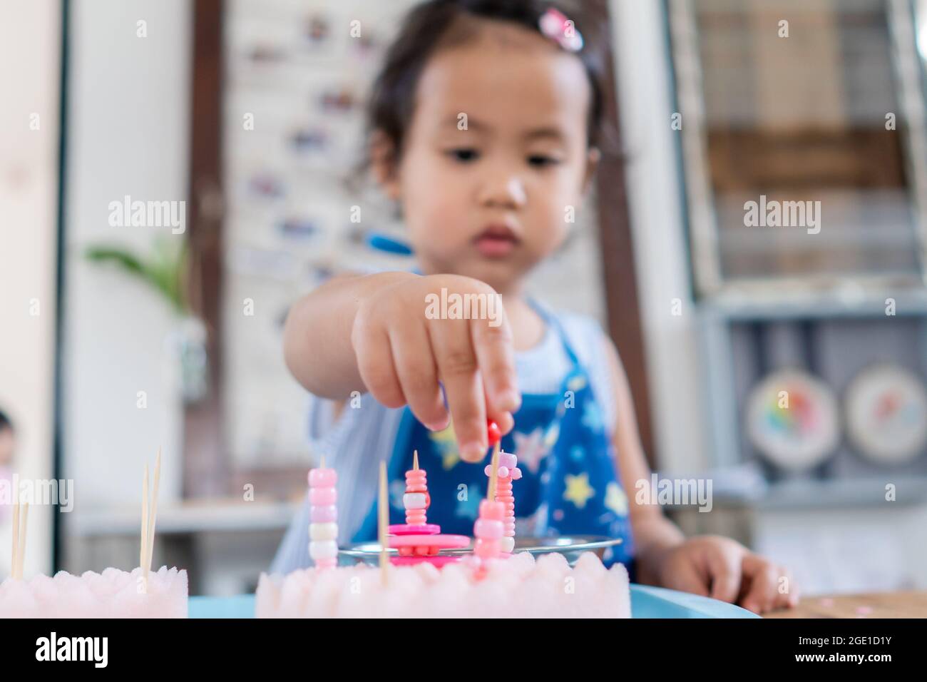 Thai cute little girl playing at kindergarten Stock Photo - Alamy