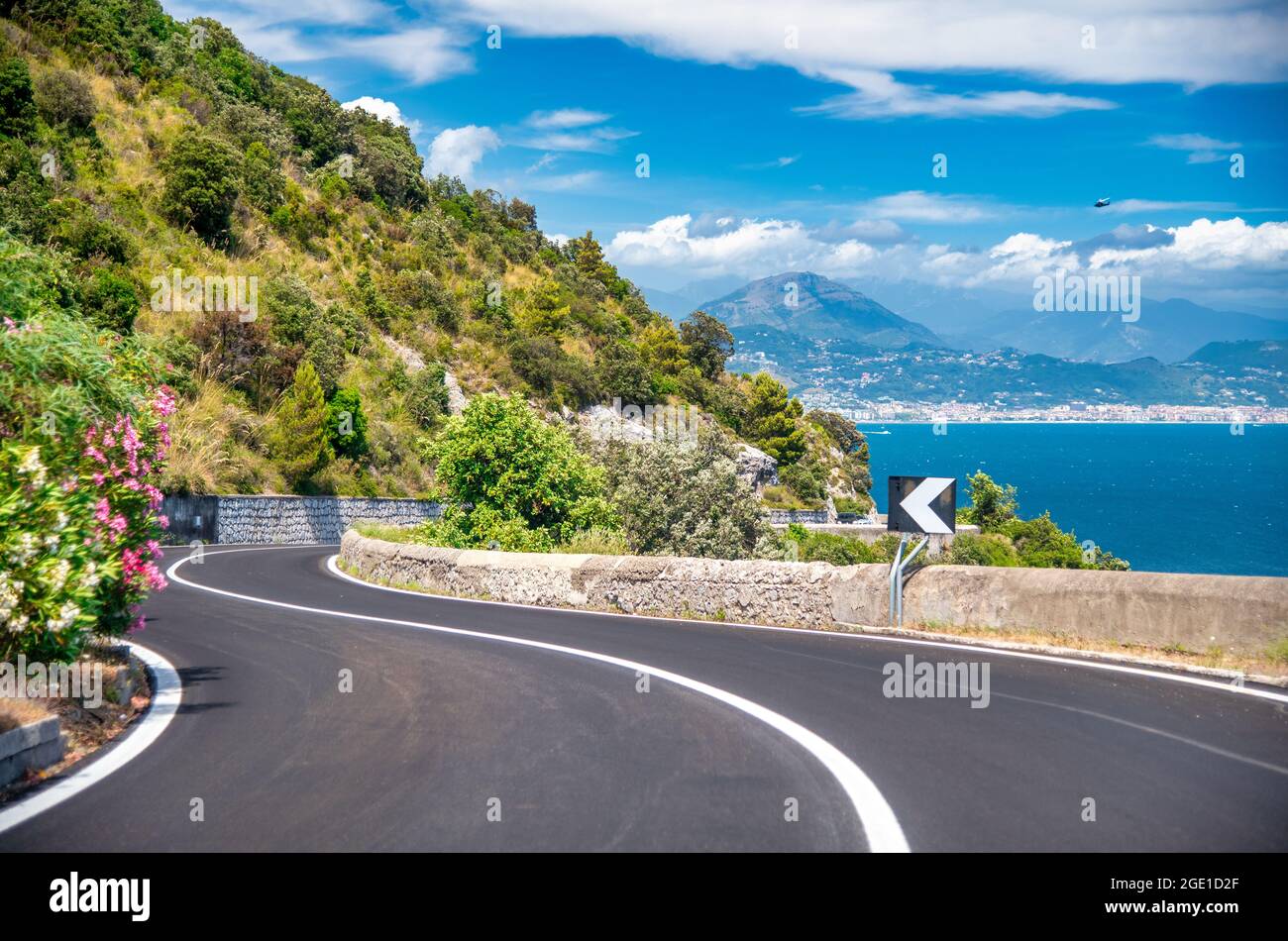 Empty highway beside a beautiful mountain landscape overlooking an ...