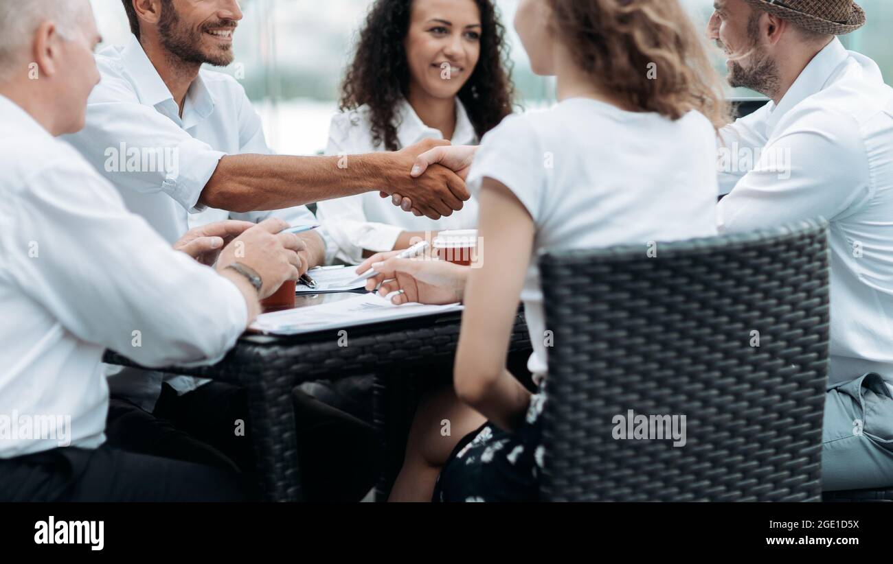 business partners greeting each other with a handshake during a working meeting Stock Photo - Alamy
