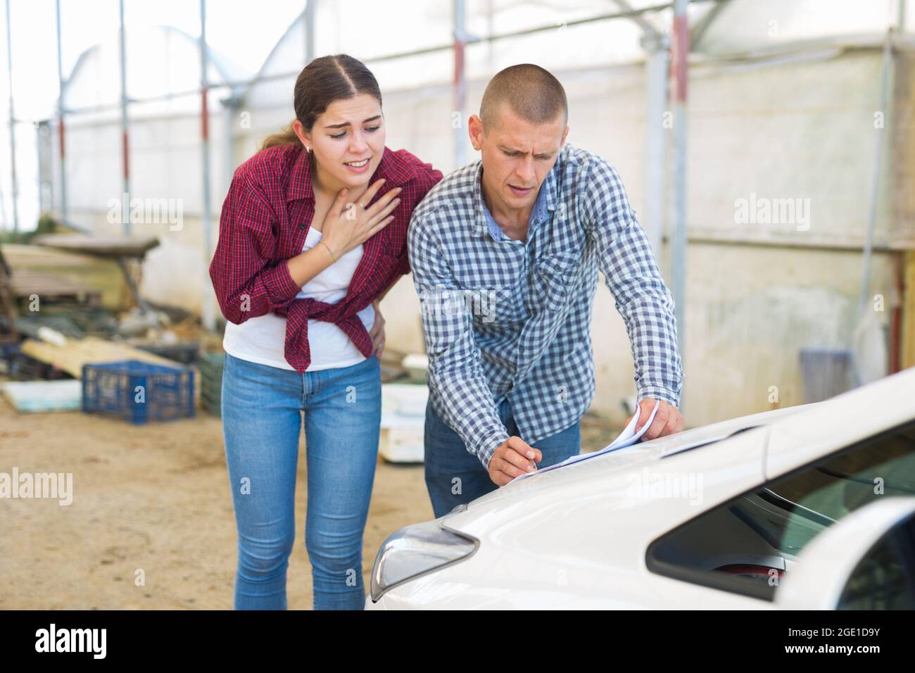 Girl watching how man writing something Stock Photo - Alamy