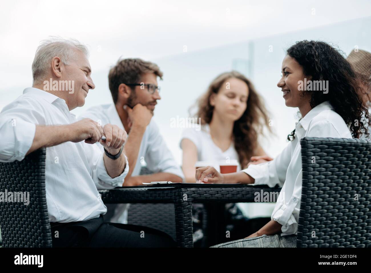 group of business people sitting at the discussion table of the Stock ...