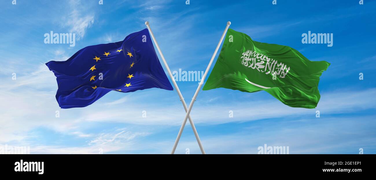 flags of European Union and Saudi Arabia waving in the wind on ...