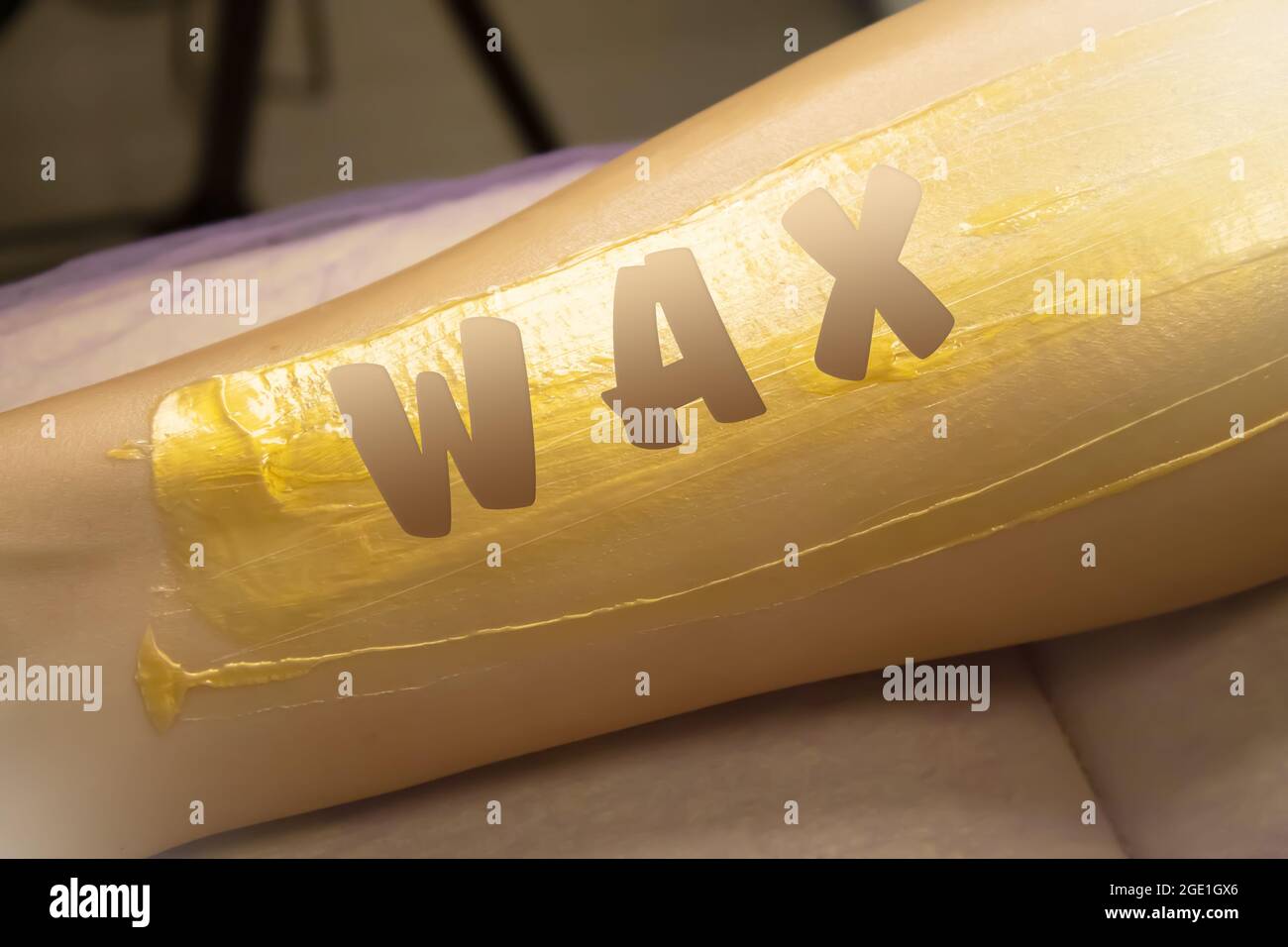 Hair removal with wax. Shugaring. Wax depilation. Wax strip on the leg ...