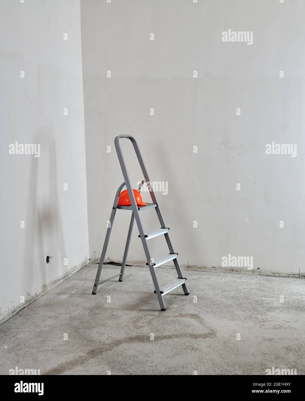construction ladder for repair stands with a helmet Stock Photo - Alamy