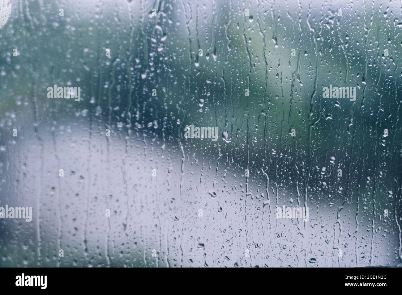 rain drops during raining in rainy day outside window glass with ...