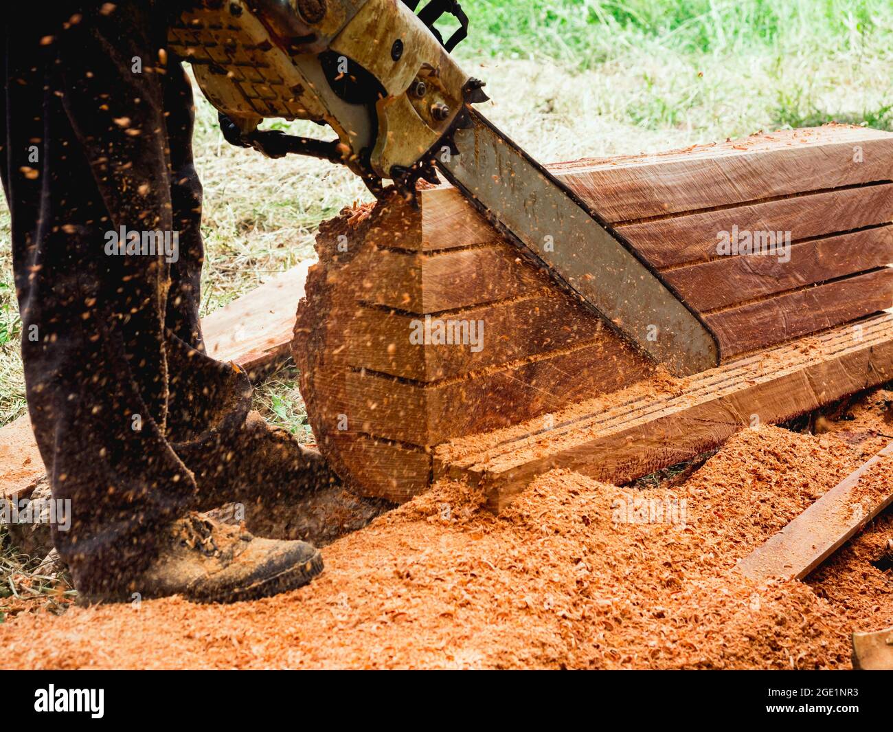 Old man cutting log hi-res stock photography and images - Alamy