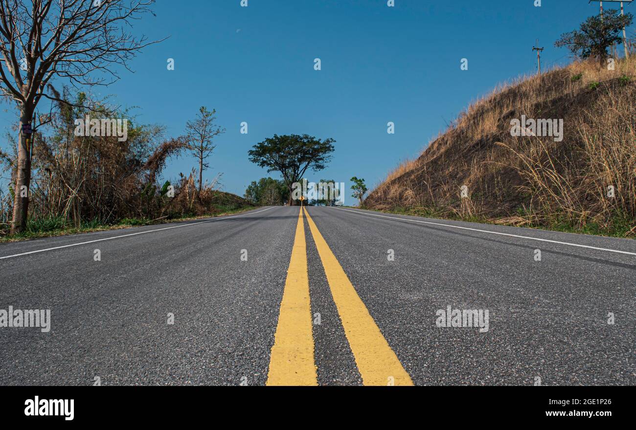 Country asphalt road with sky background. Rural uphill road Stock Photo ...
