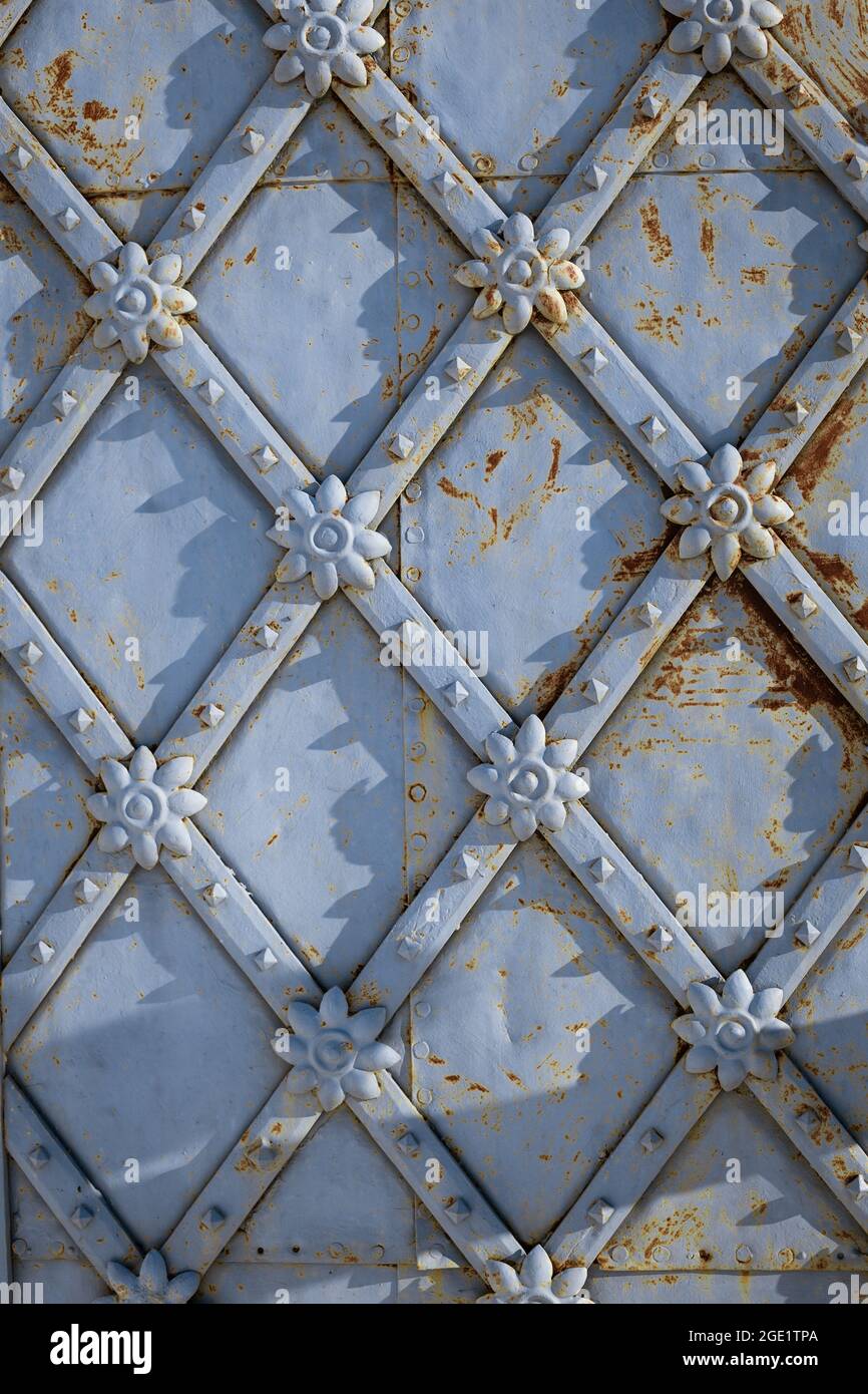 decorative wrought-iron elements on antique iron, rusty doors close-up ...