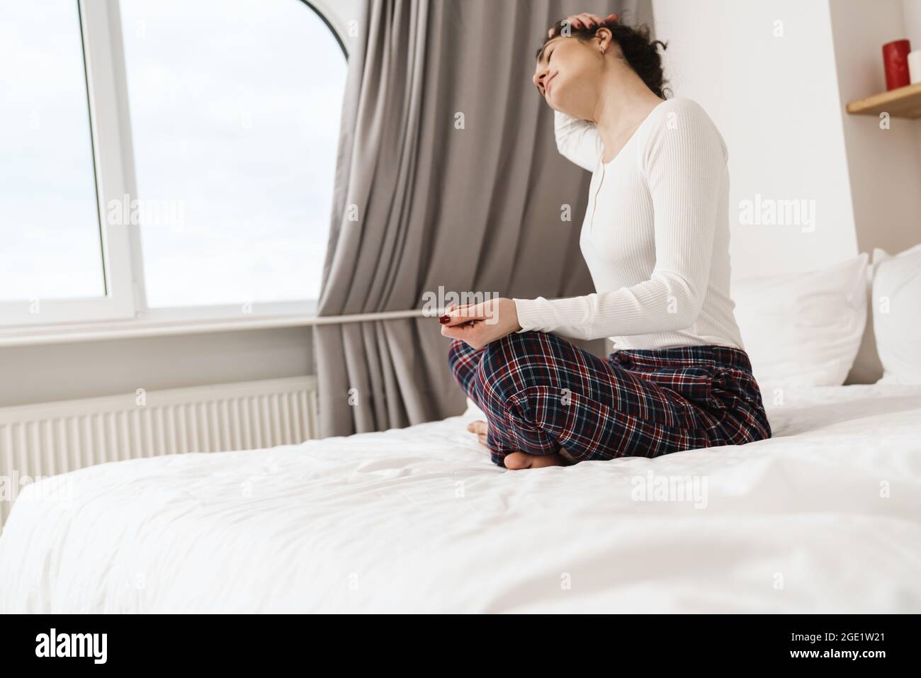 Legs on bed hi-res stock photography and images - Alamy