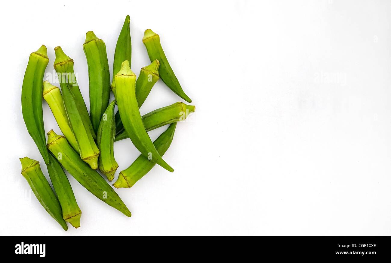Raw okra or ladyfingers isolated on white background Stock Photo - Alamy