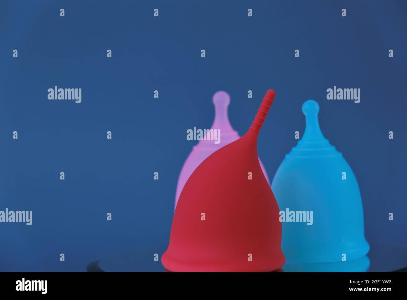 Menstrual cups.Menstrual period.menstrual silicone cups set on dark ...