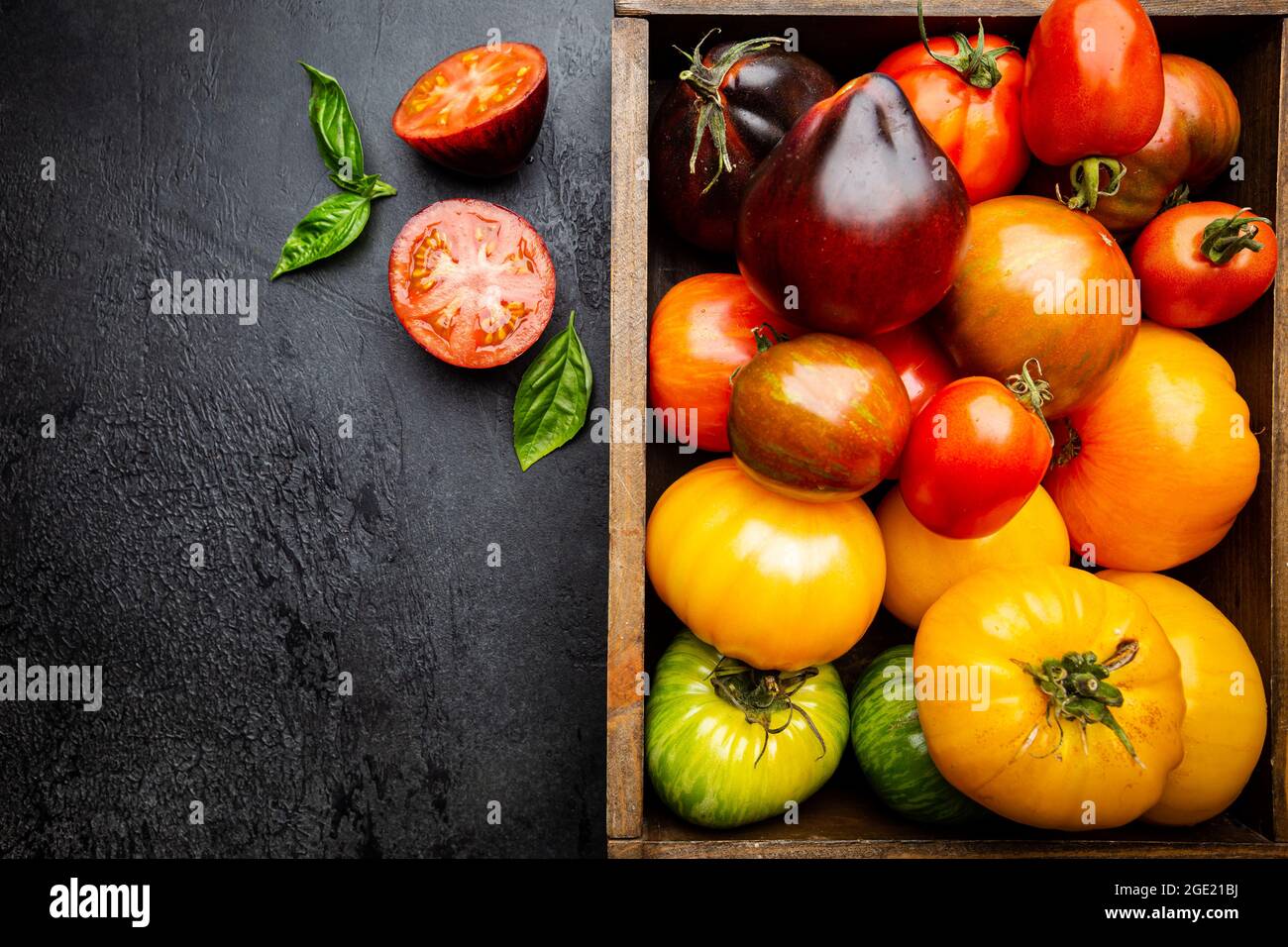 Mixed tomatoes top view. Composition with variety of colorful fresh ...