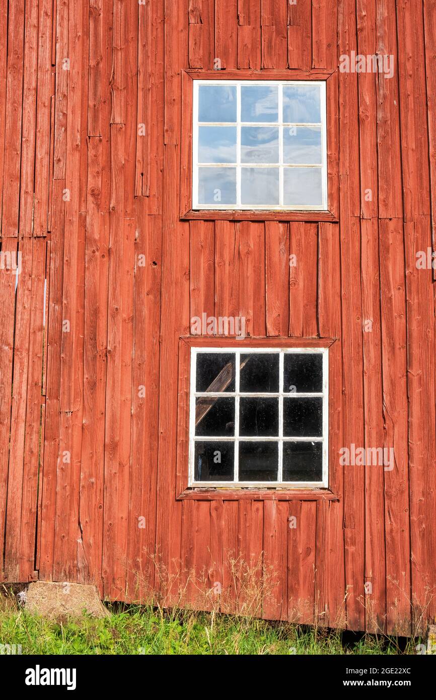 Red wall with white windows on a barn Stock Photo - Alamy