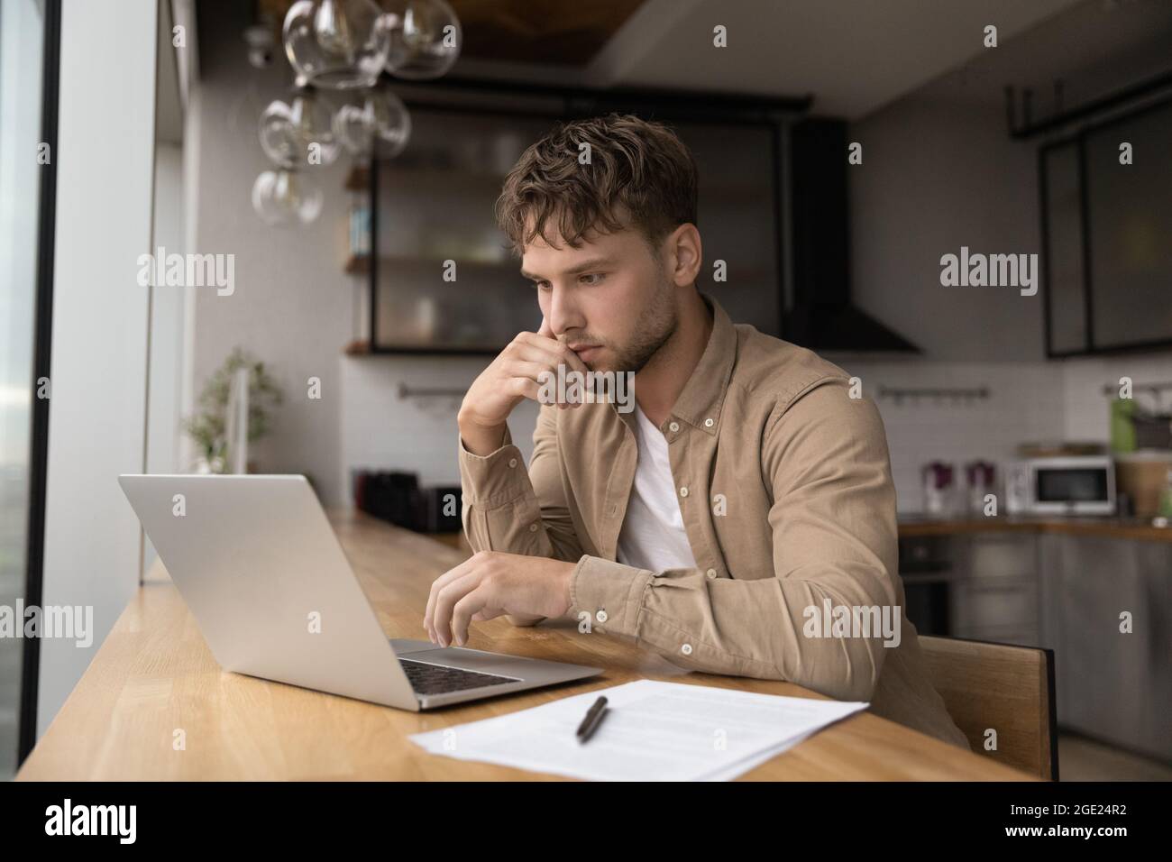 Academic man working on computer hi-res stock photography and images ...