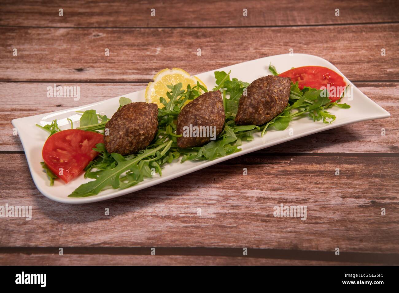 Traditional kebbe and pita bread on big round plate in lebanese ...