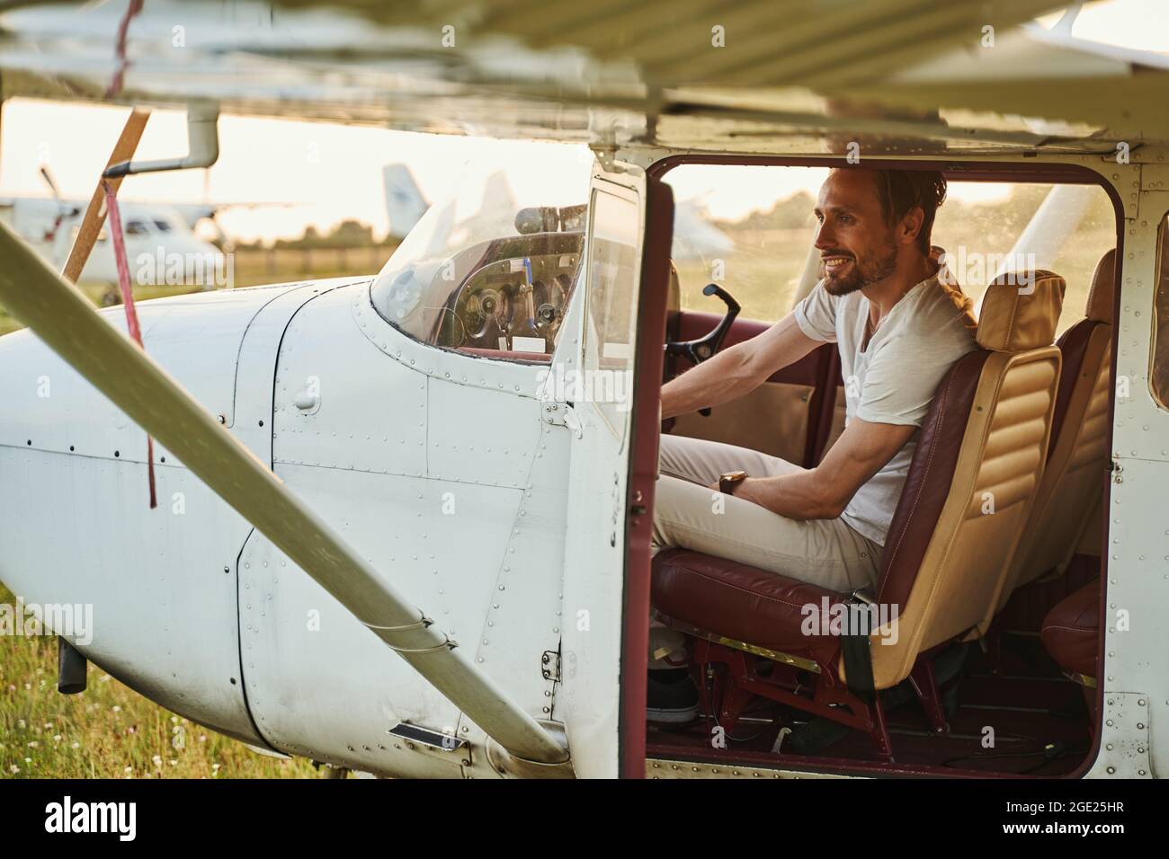 Focused photo on man sitting in plane Stock Photo - Alamy