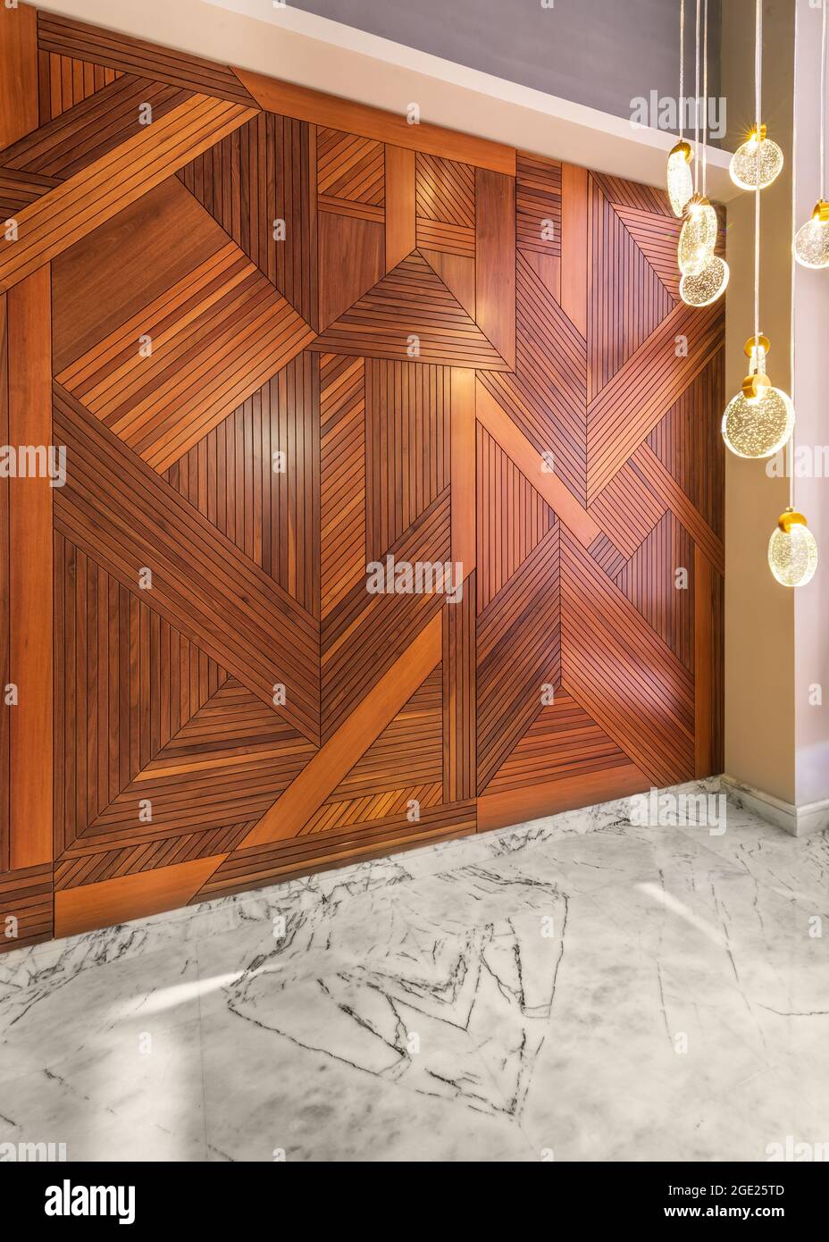 Angled view of hall with wood cladding wall decorated with geometrical ...