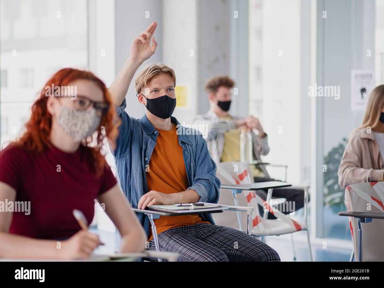 Portrait of university student in classroom indoors, coronavirus and ...