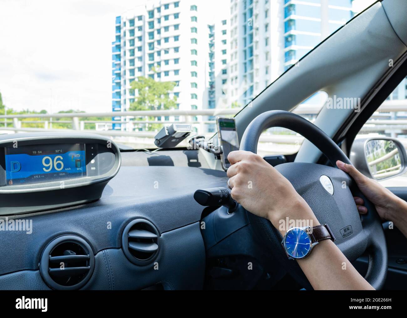 Dashboard of an electric car driven by a young man with brown skin ...