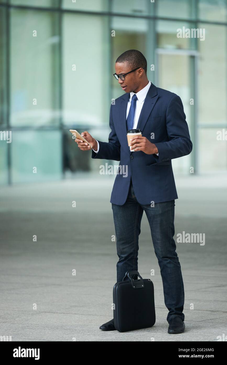 Serious Businessman With Suitcase