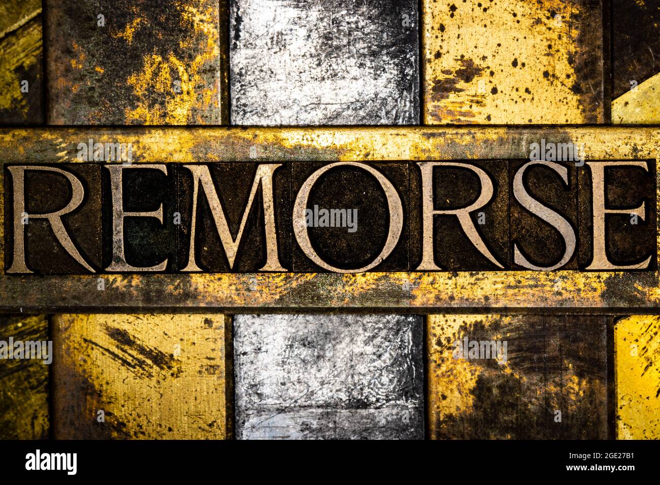 Remorse text on vintage textured copper and gold background Stock Photo ...
