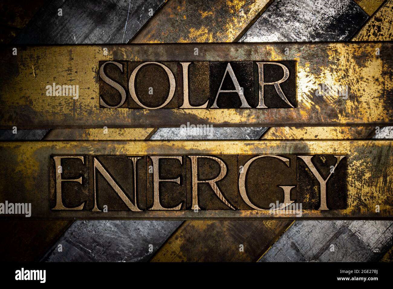 Solar Energy text on textured grunge copper and vintage gold background ...