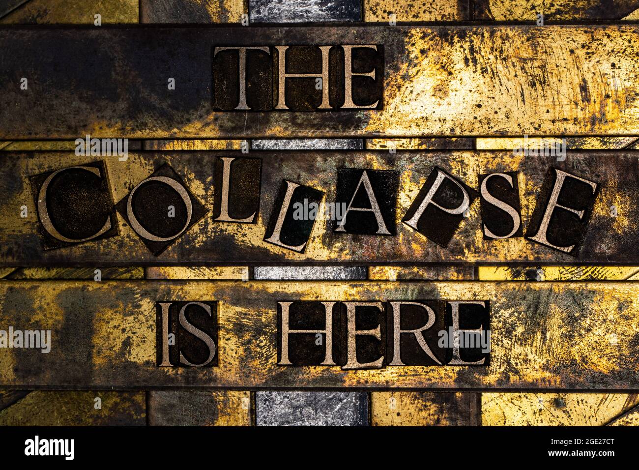 The Collapse Is Here text on vintage textured grunge gold and copper ...