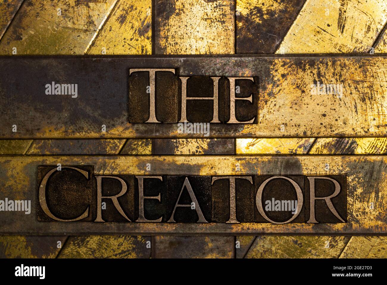 The Creator text on textured grunge copper and vintage gold background ...