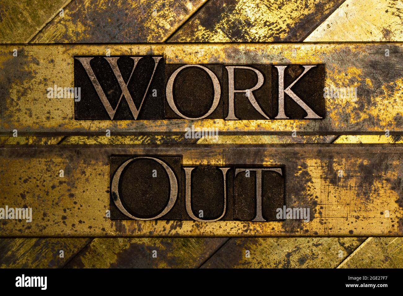 Work Out text with barbed wire on vintage textured grunge copper and ...