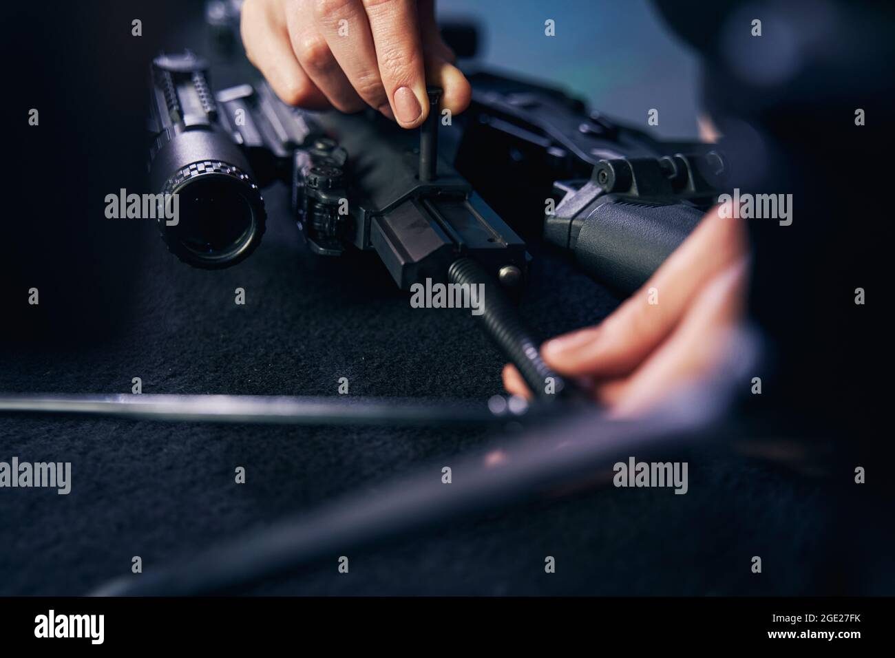 Experienced person fixing a firing pin on the firearm Stock Photo - Alamy