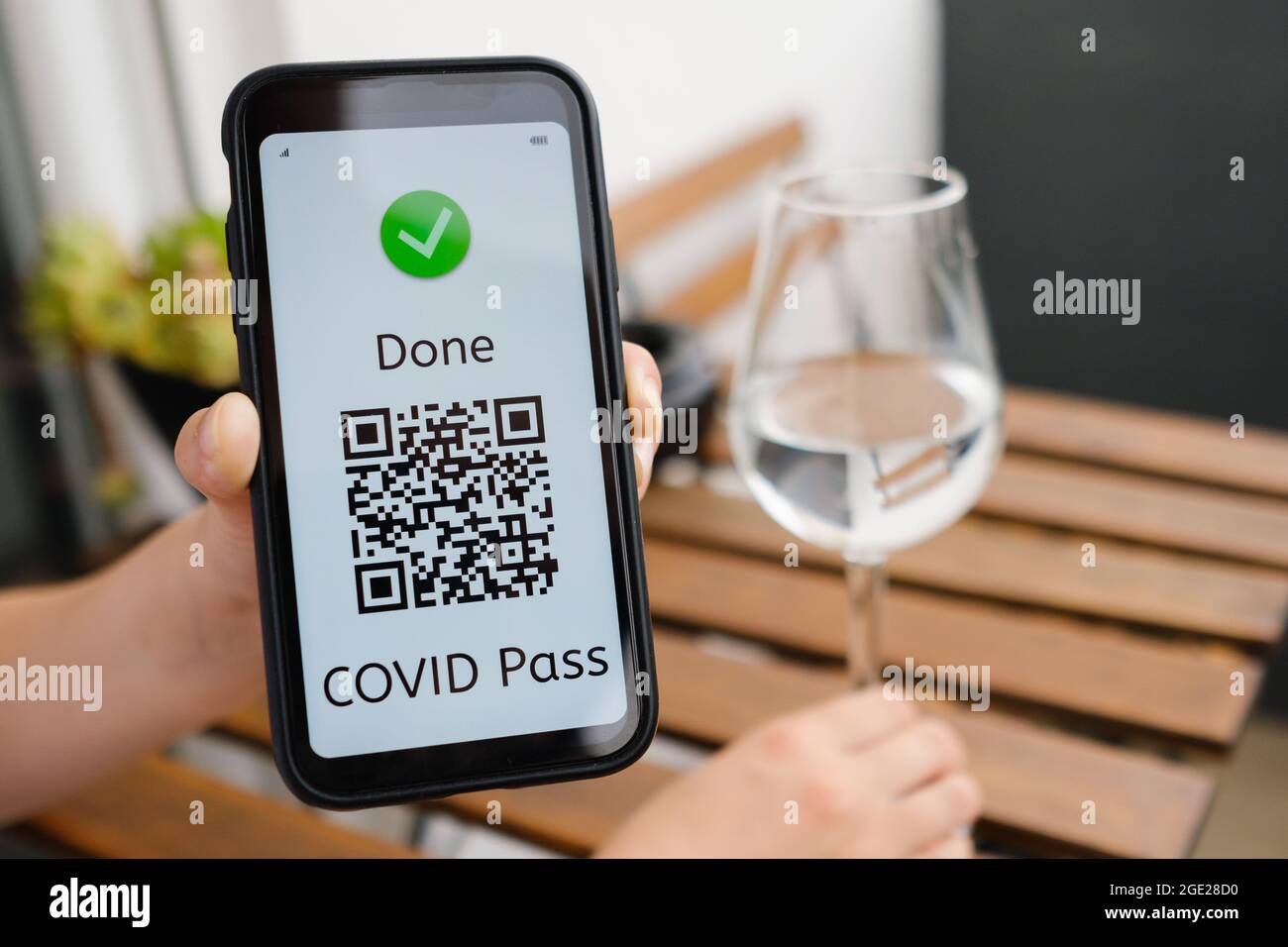 Woman demonstrates Covid pass application or digital health passport ...