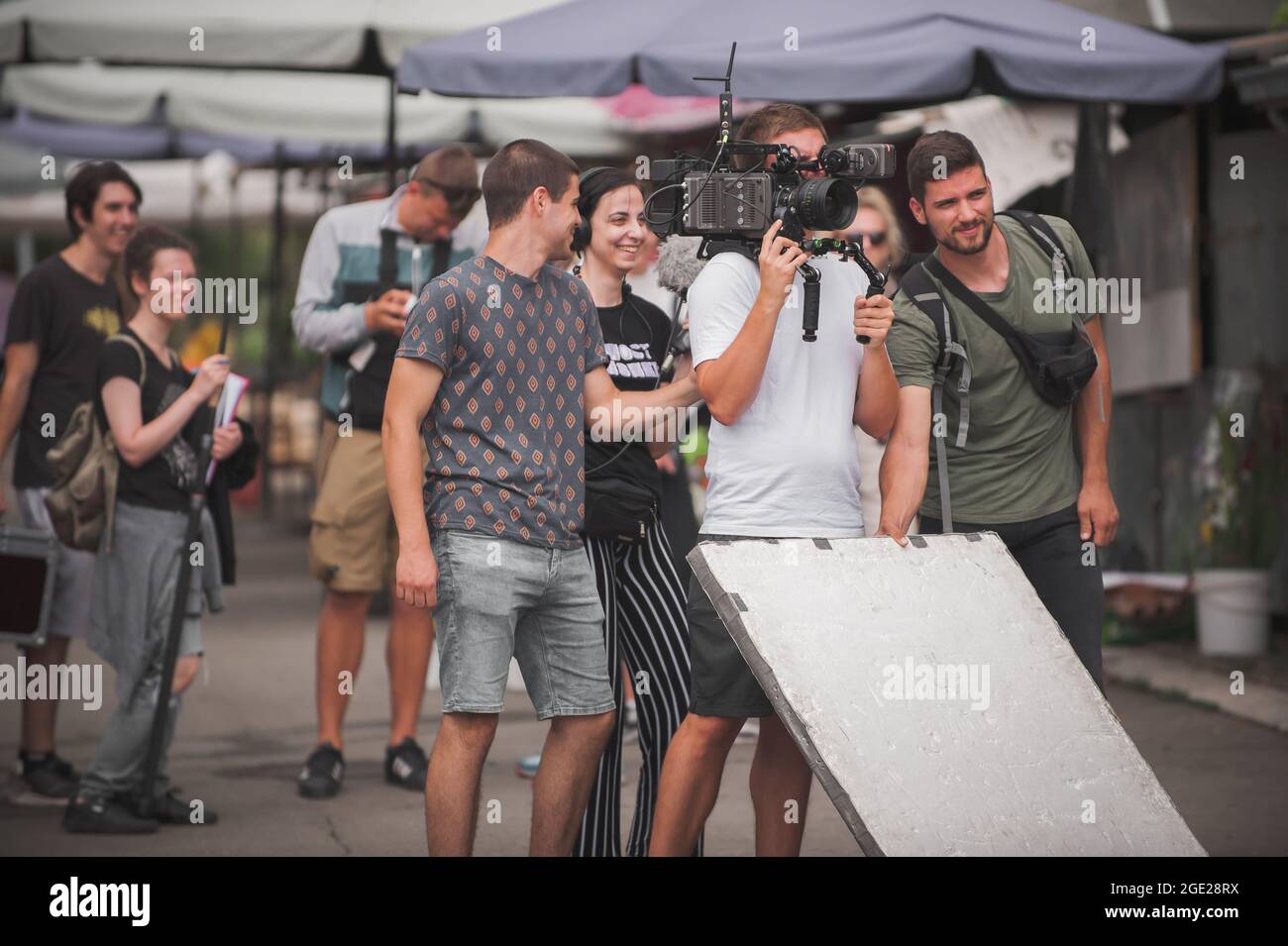 Behind the scenes. Film crew team shooting movie scene on outdoor ...
