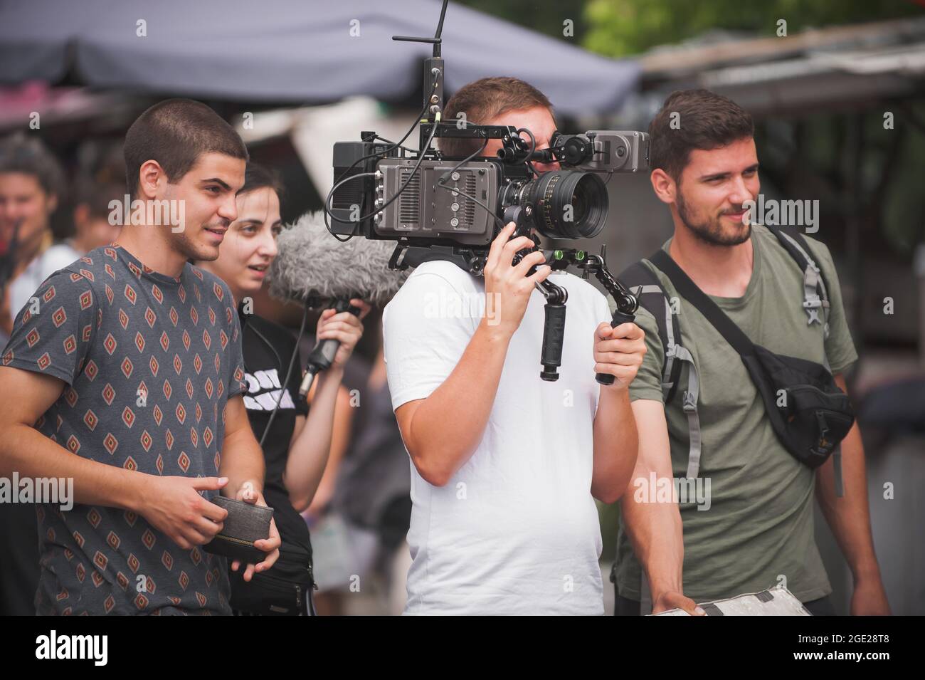 Behind the scenes. Film crew team shooting movie scene on outdoor ...