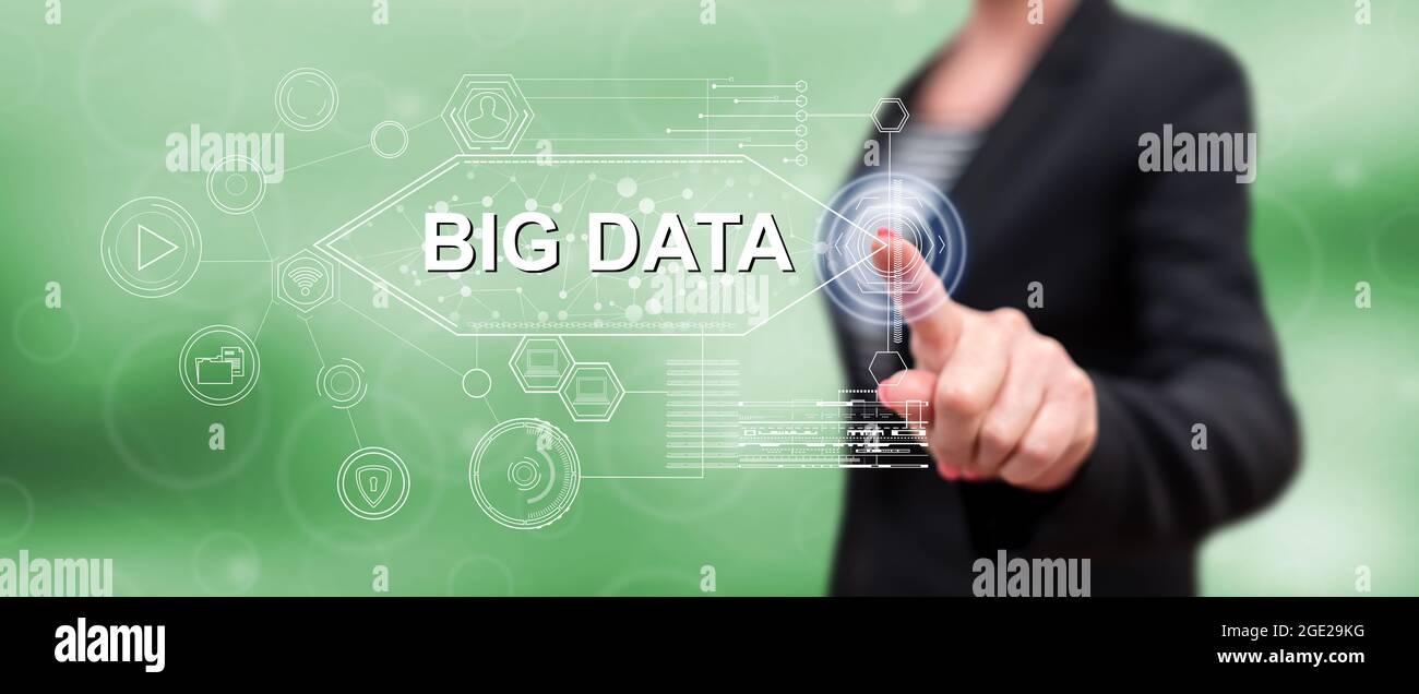 Woman touching a big data concept on a touch screen with her finger ...