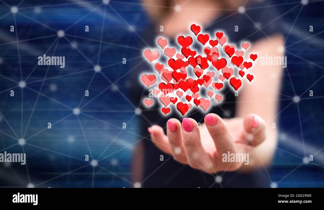 Online dating concept above the hand of a woman in background Stock ...