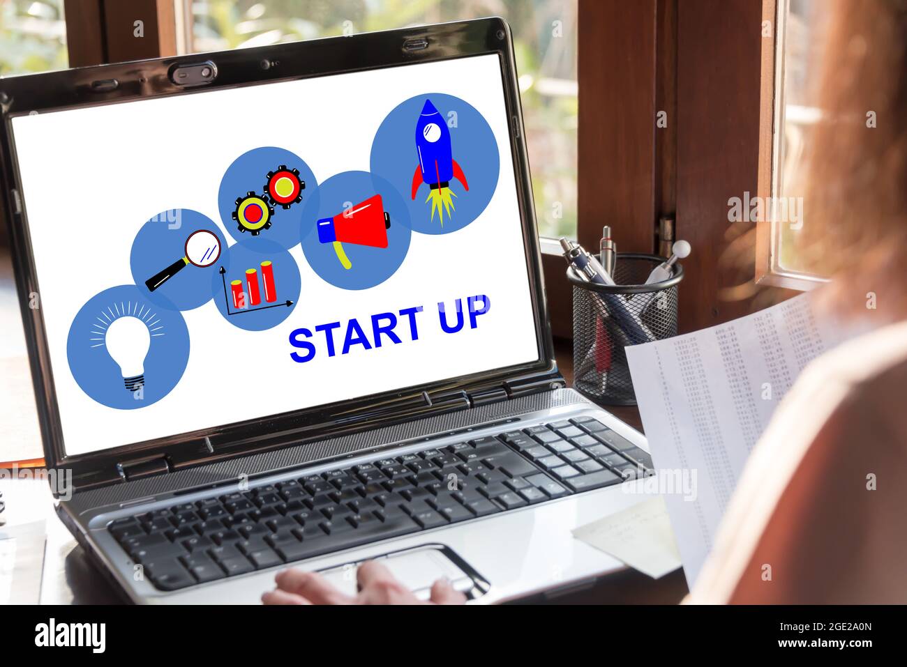 Laptop screen showing start up concept Stock Photo - Alamy