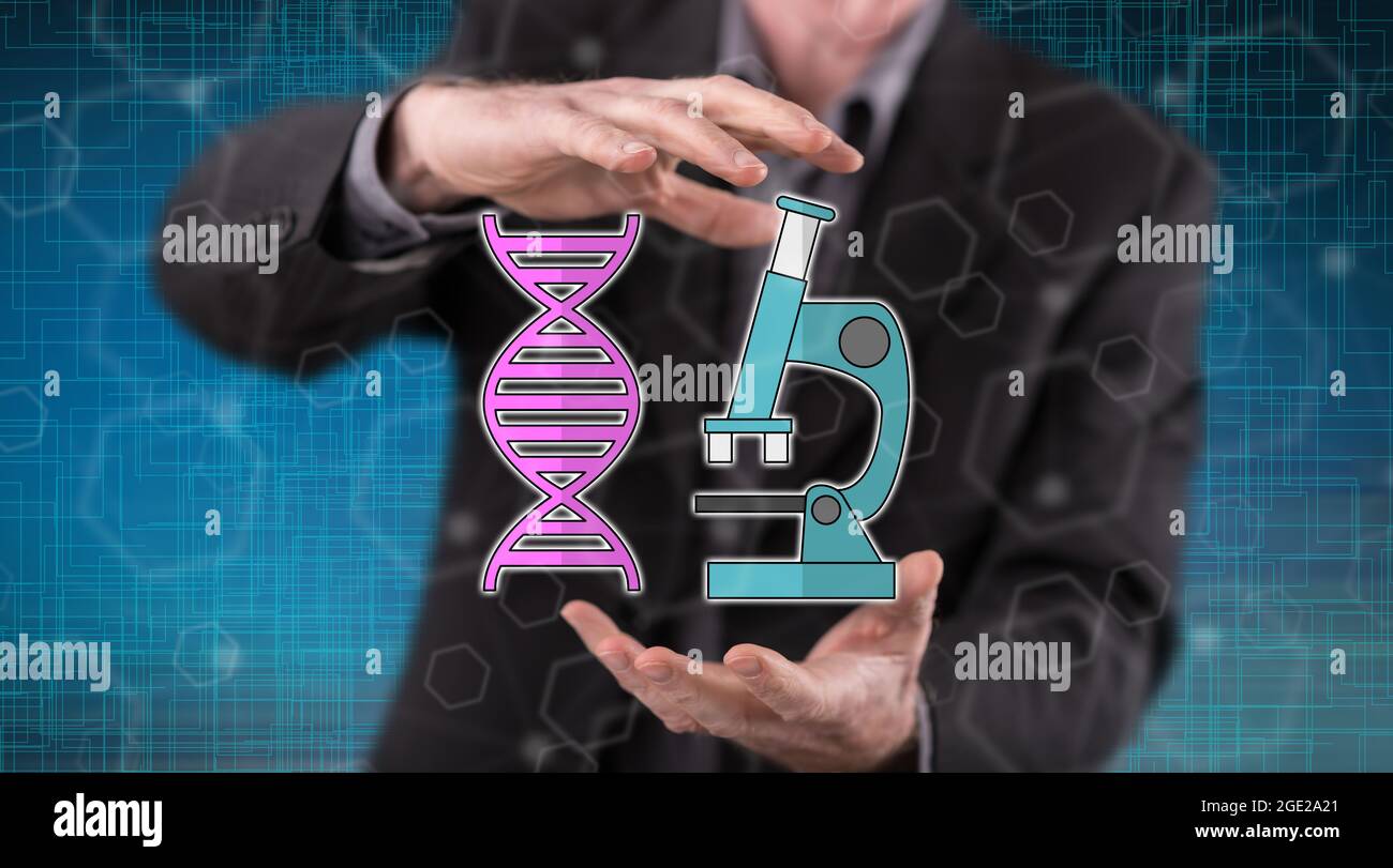 Dna technology concept between hands of a man in background Stock Photo ...