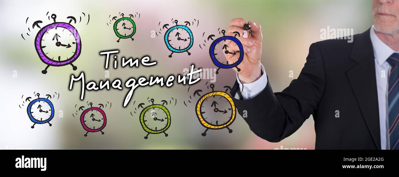 Businessman drawing a time management concept Stock Photo - Alamy