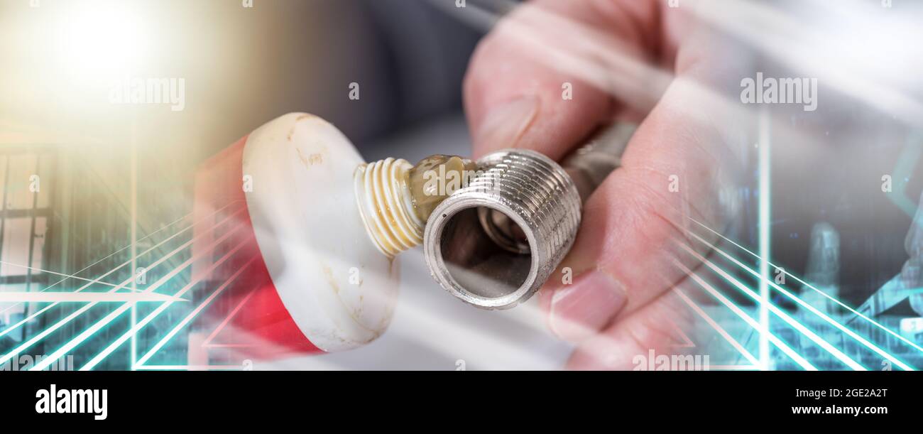 Plumber putting sealing paste on a thread, closeup; multiple exposure ...