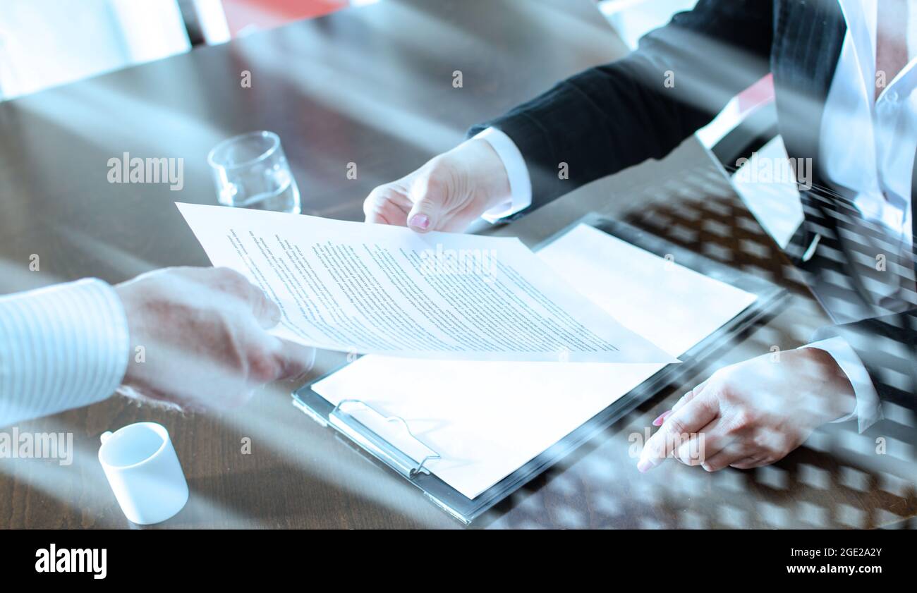 Document handing at office; light effect Stock Photo - Alamy