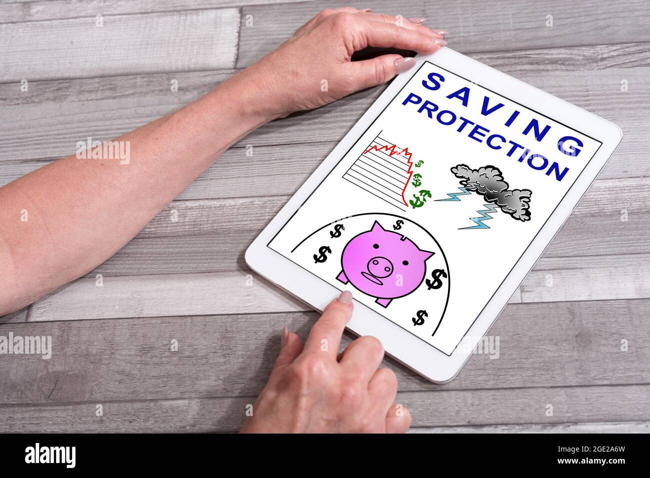 Saving protection concept shown on a tablet used by a woman Stock Photo ...