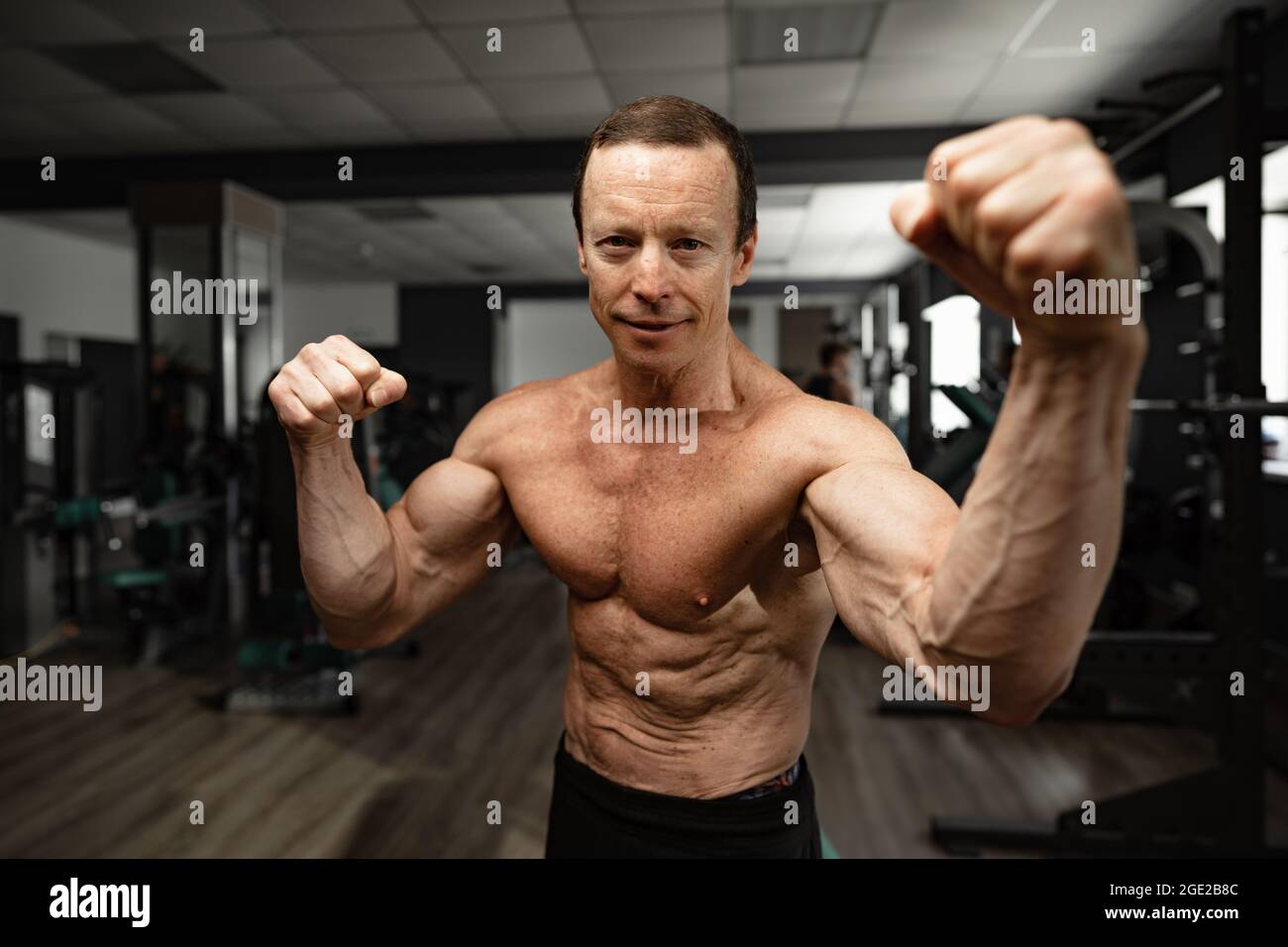 Portrait of a senior muscular man in a gym Stock Photo - Alamy