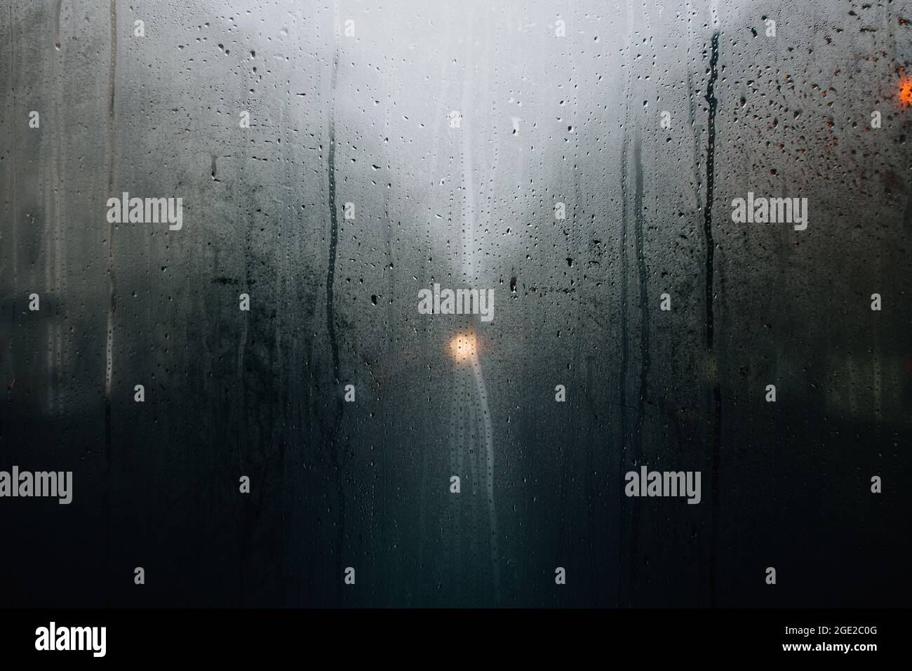 Wet window with raindrops on it Stock Photo - Alamy