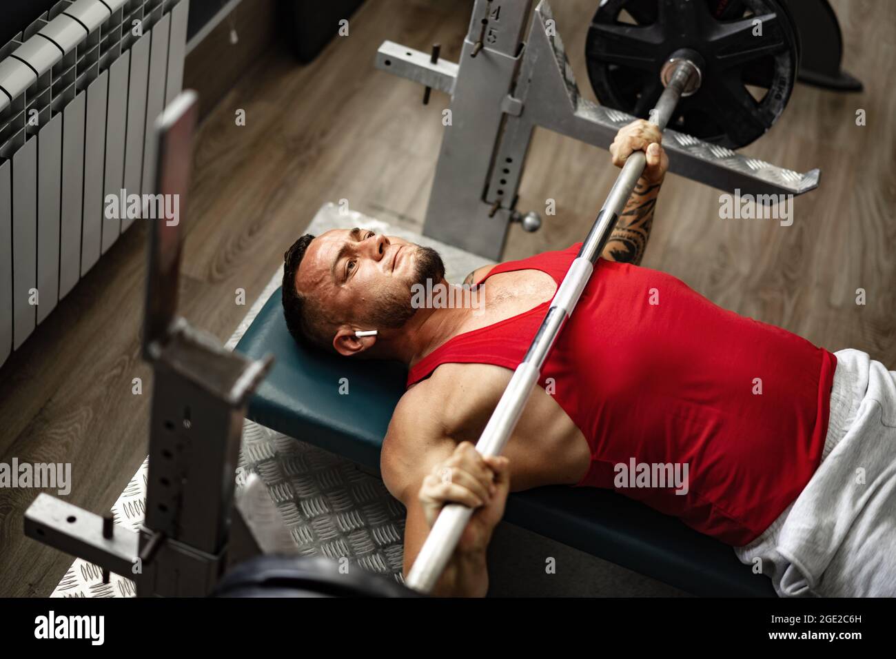 Strong man athlete exercise in gym, close up portrait Stock Photo - Alamy