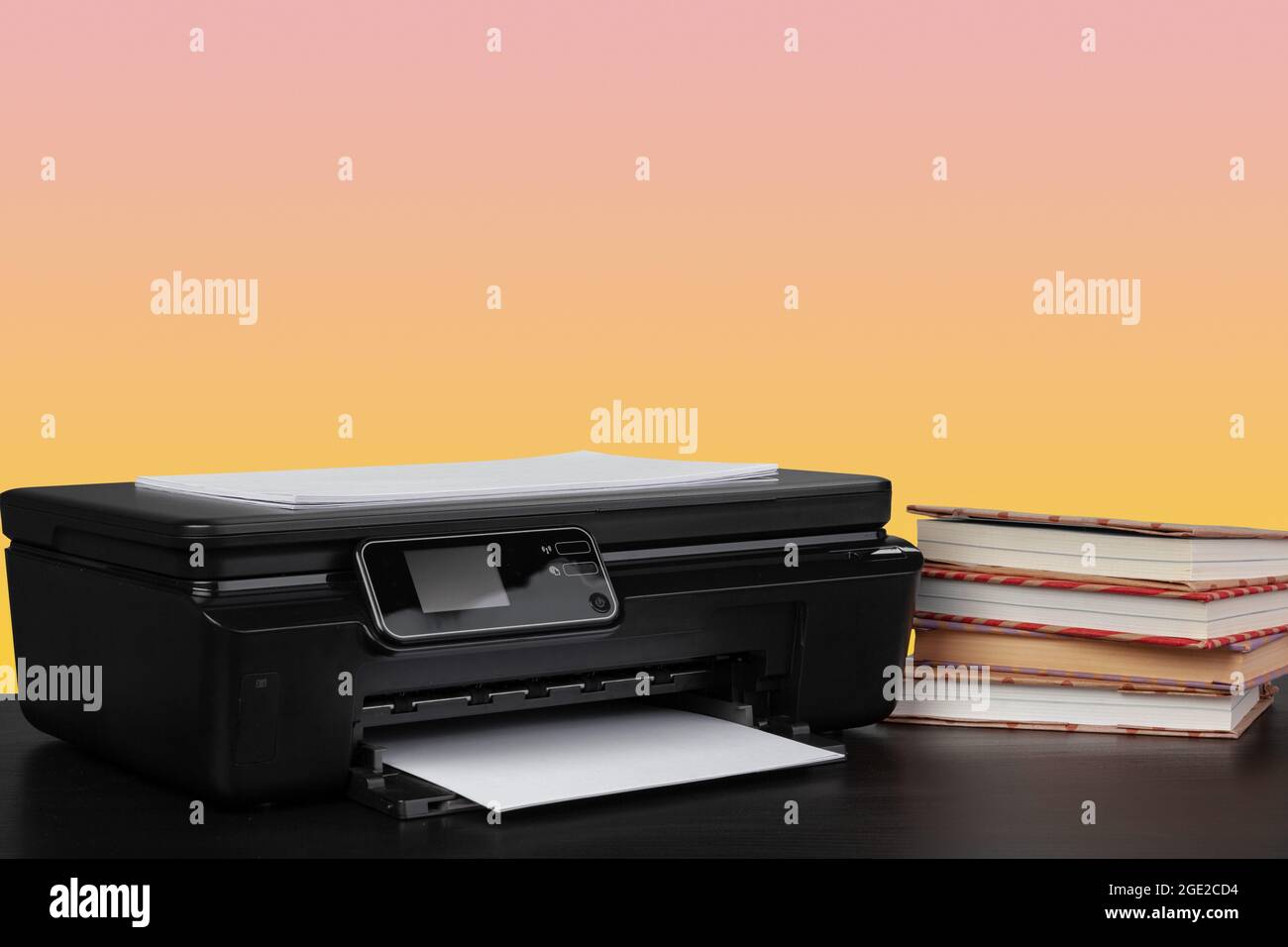 Compact home laser printer against yellow background Stock Photo - Alamy